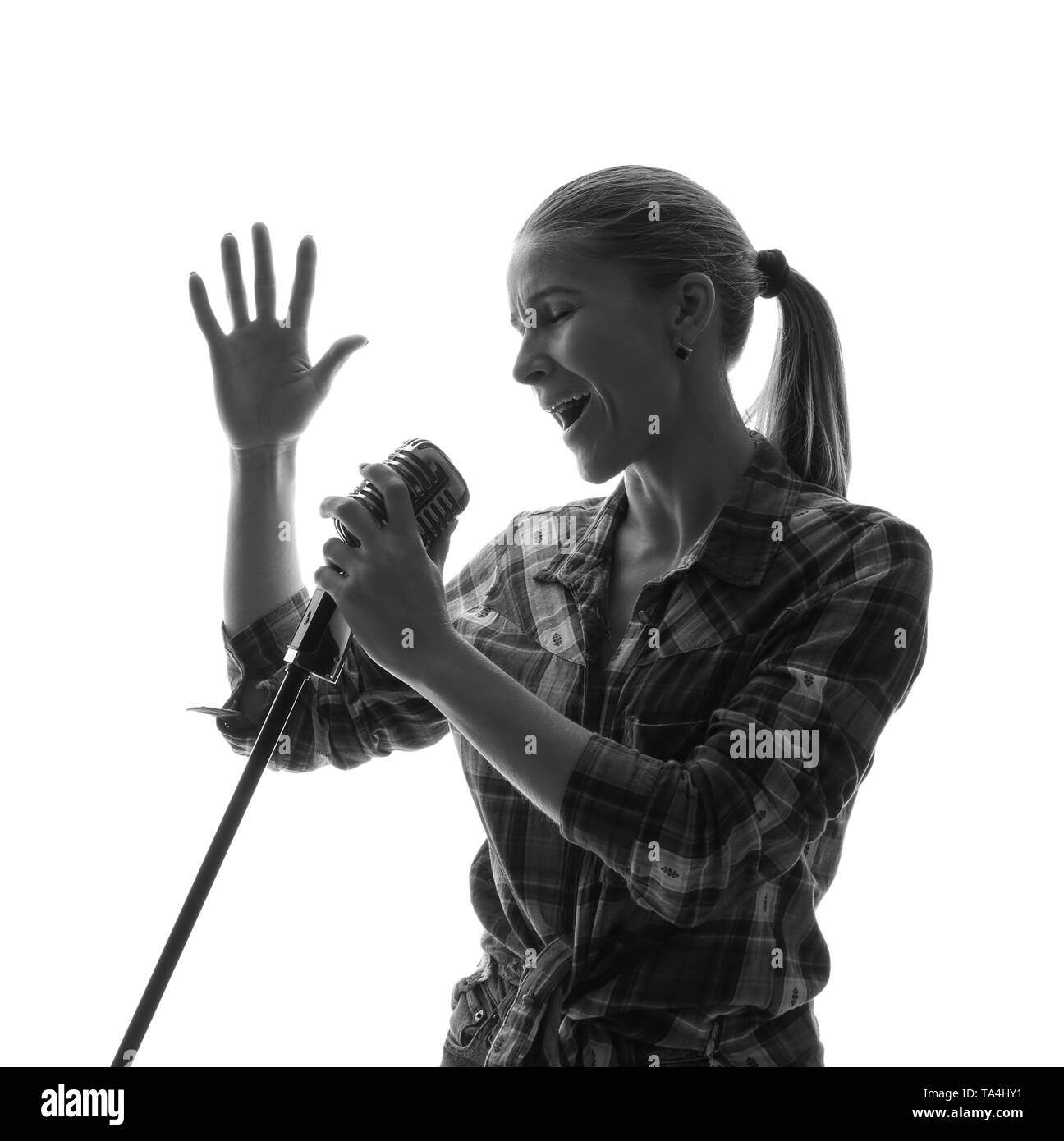 Female singer on stage silhouette Black and White Stock Photos & Images ...