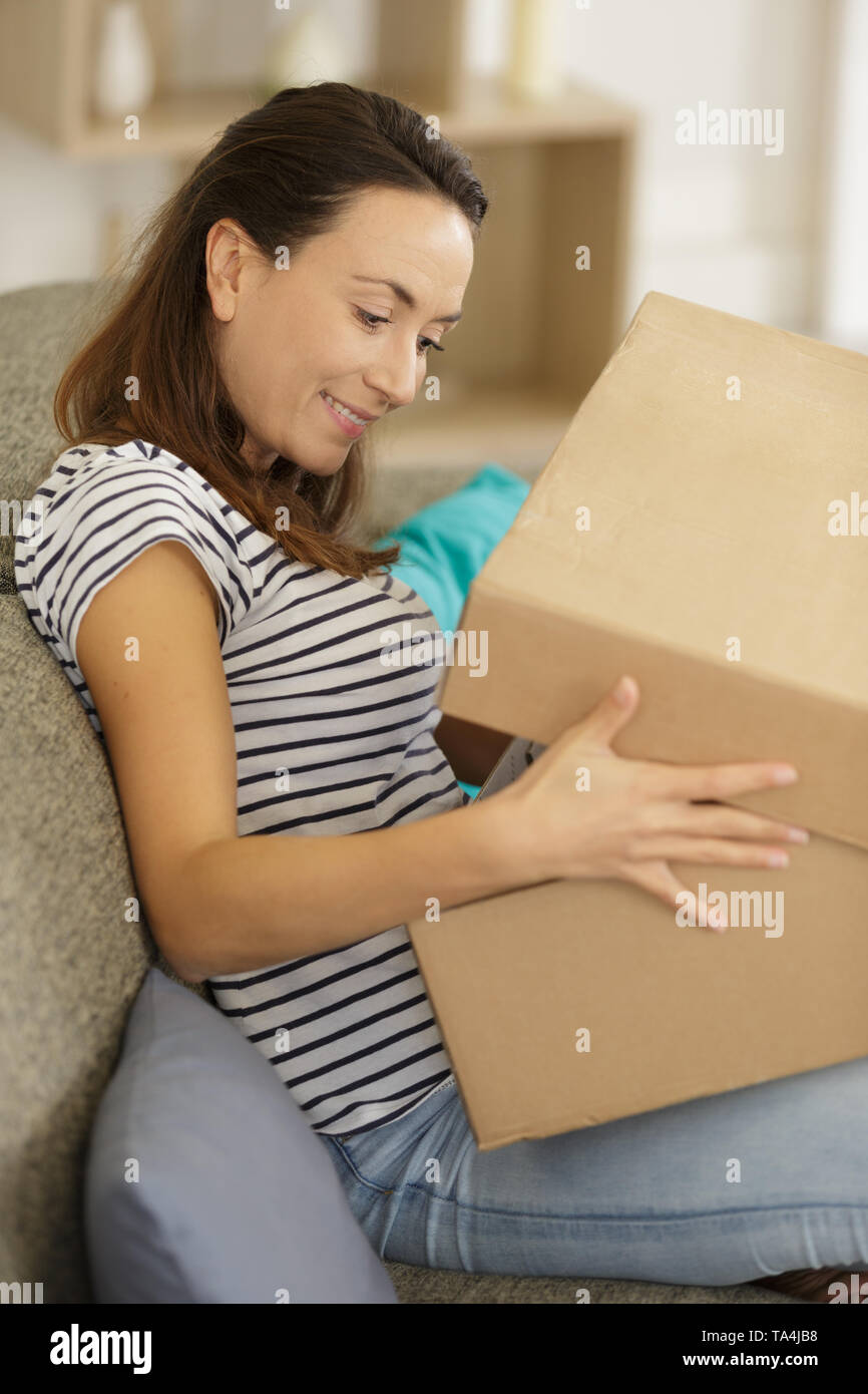 Happy customer opening parcel hi-res stock photography and images - Alamy