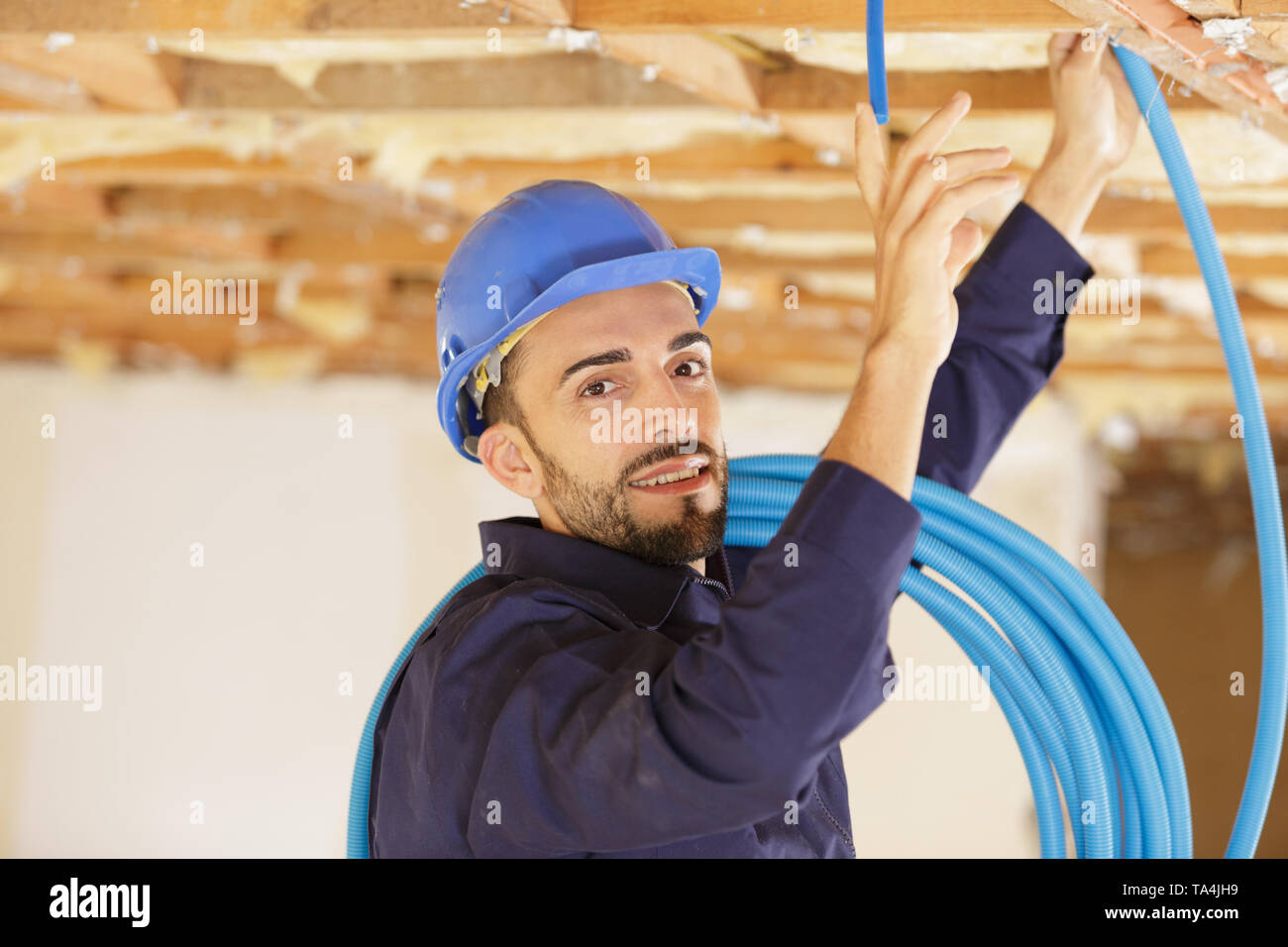 worker sets the ceiling profile in new flat Stock Photo - Alamy