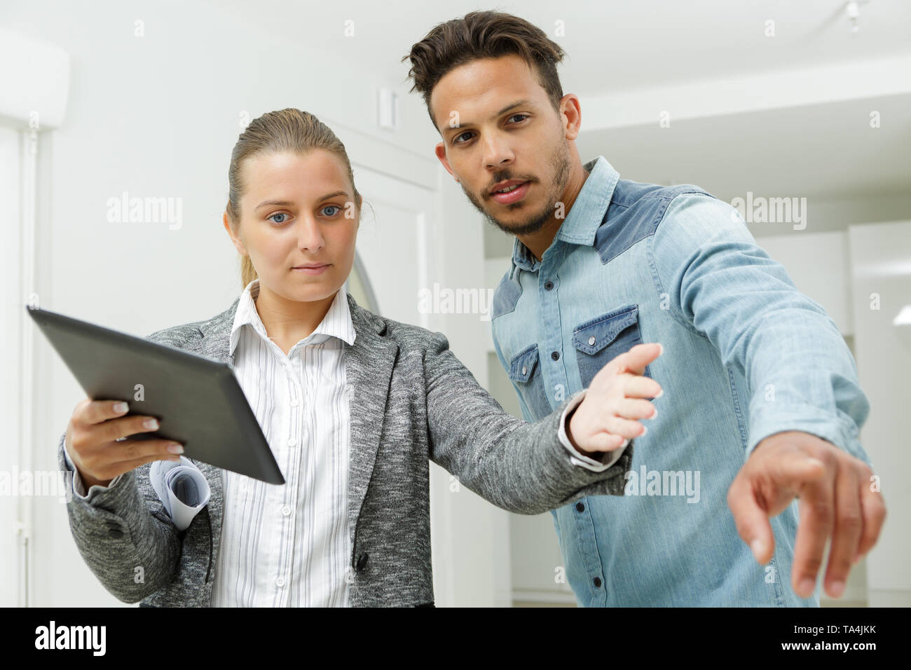 interior designer and client discussing bout the details Stock Photo ...