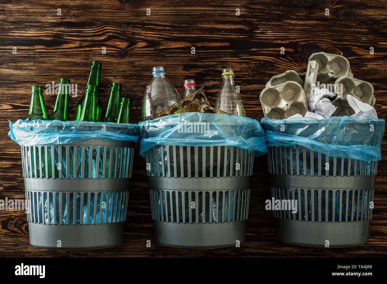 Different sorted trash on wooden background. Recycle concept Stock ...