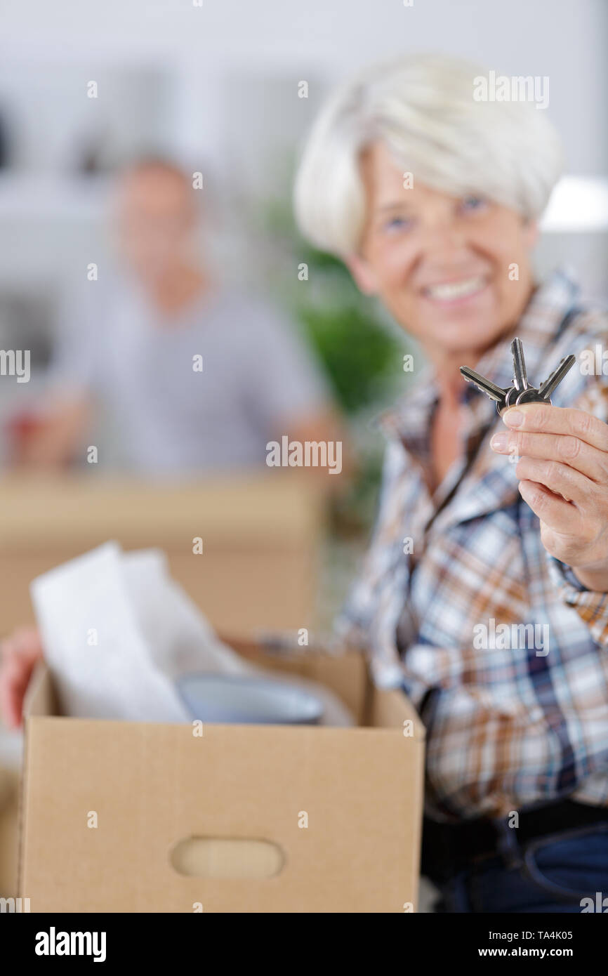 Senior lady moving home hi-res stock photography and images - Alamy