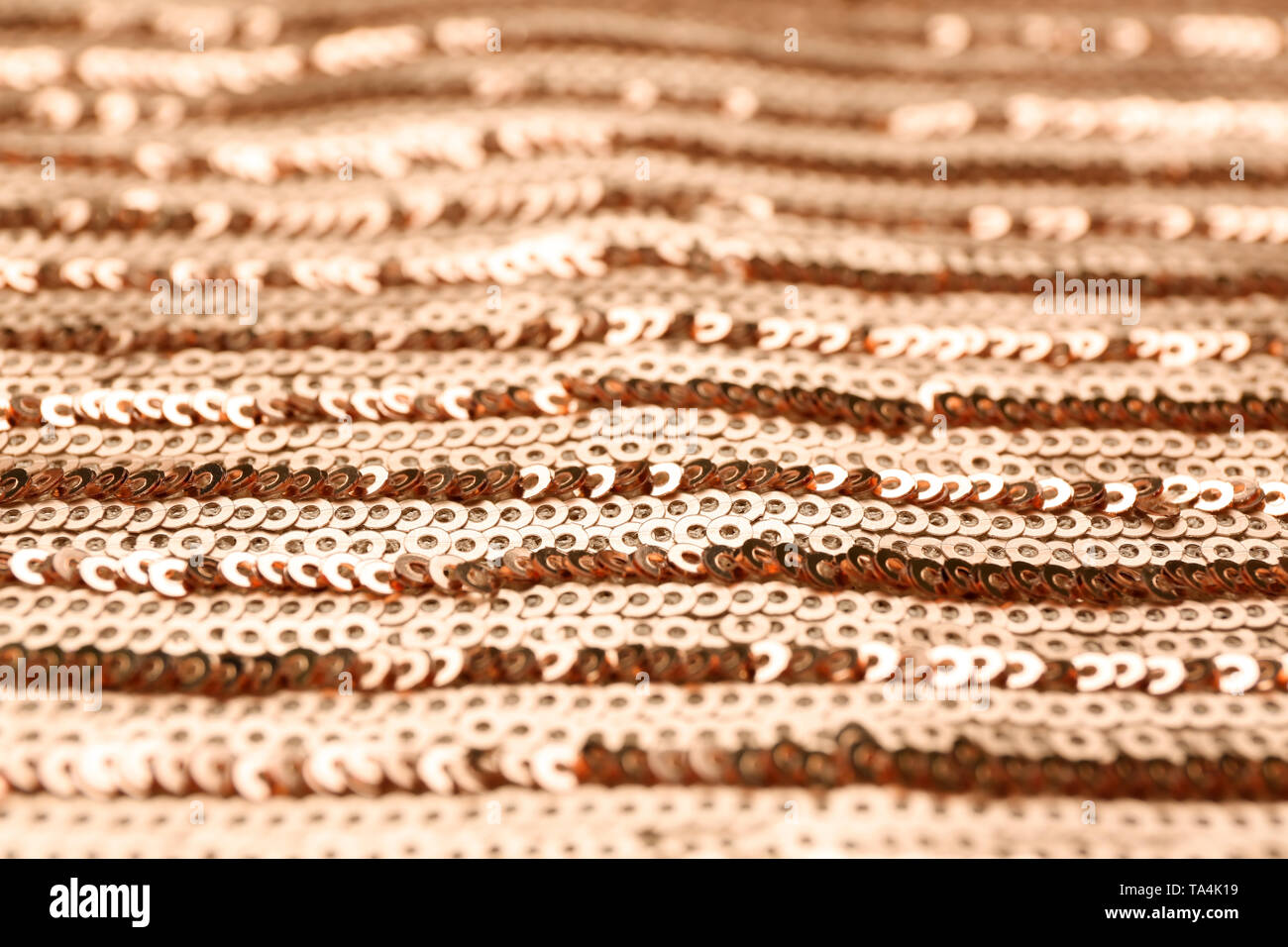 Cloth with golden sequins, closeup Stock Photo - Alamy