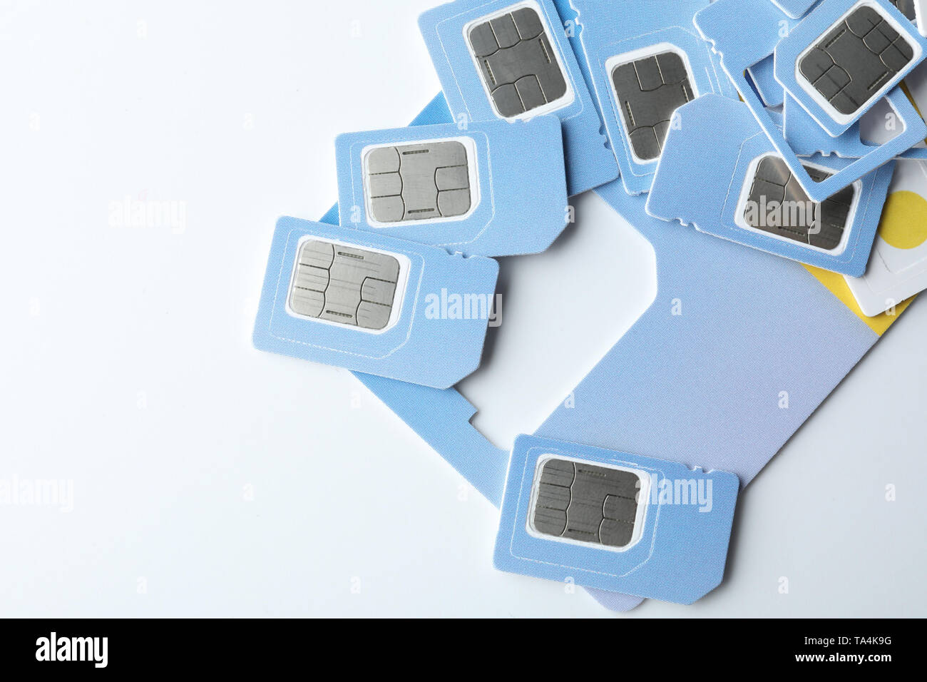 Sim cards on white background Stock Photo - Alamy