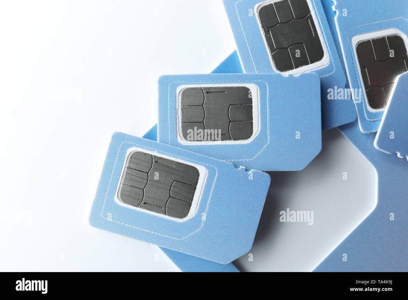 Sim cards on white background Stock Photo - Alamy