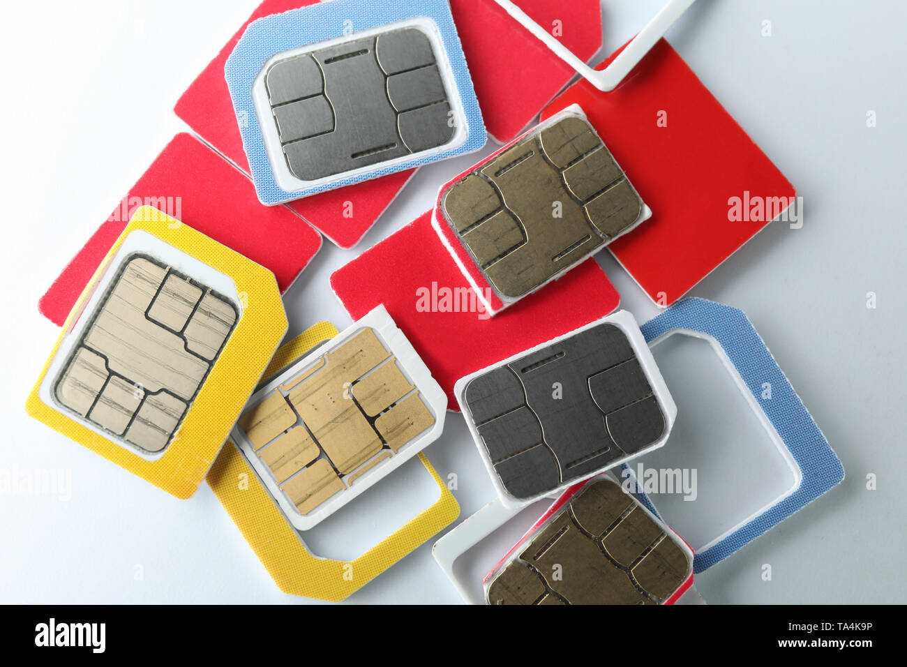 Different sim cards on white background Stock Photo - Alamy