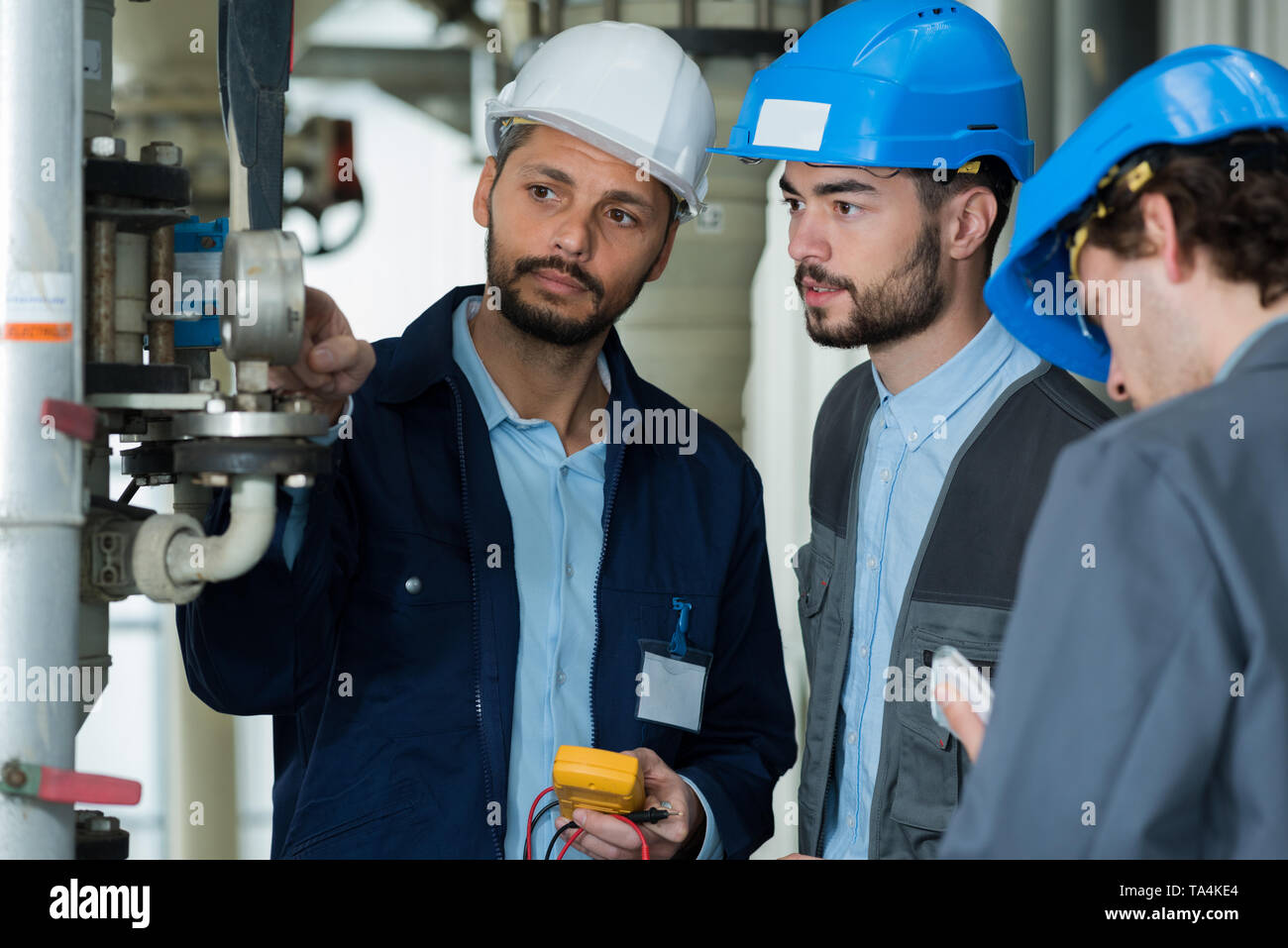 engineers in industrial machinery Stock Photo - Alamy