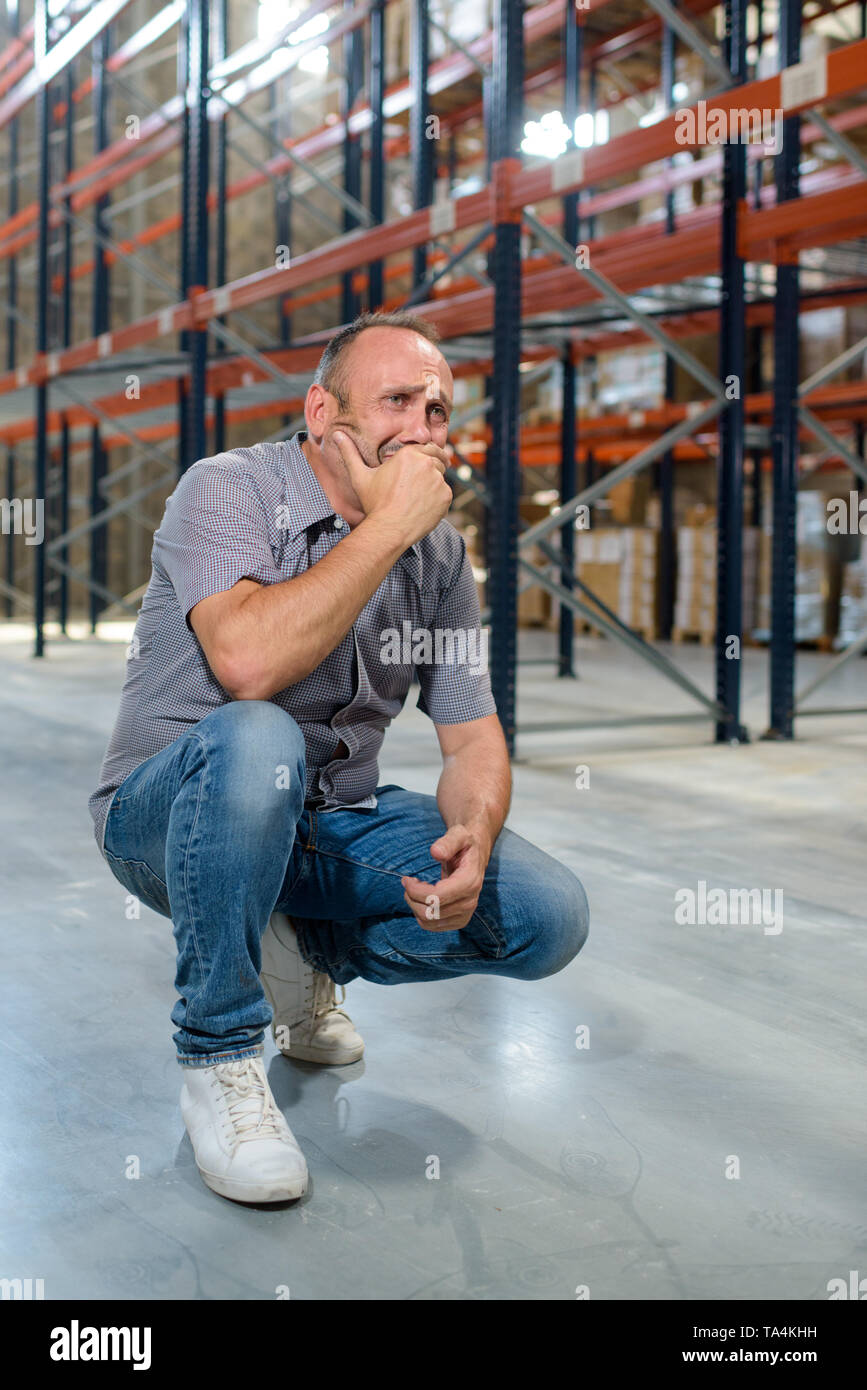 warehouse owner crying Stock Photo - Alamy
