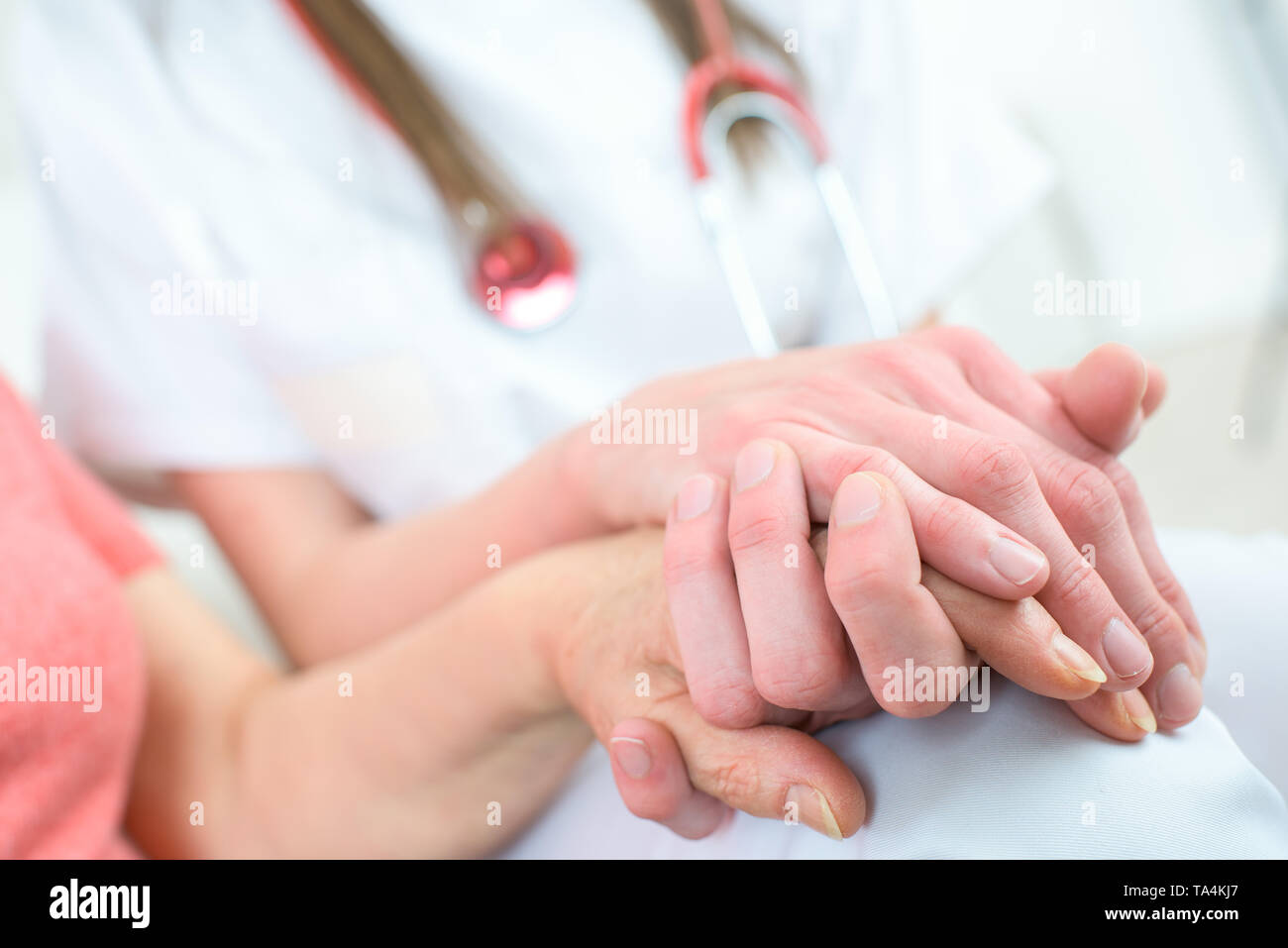 doctor holding patient hand with care giving comfort Stock Photo - Alamy