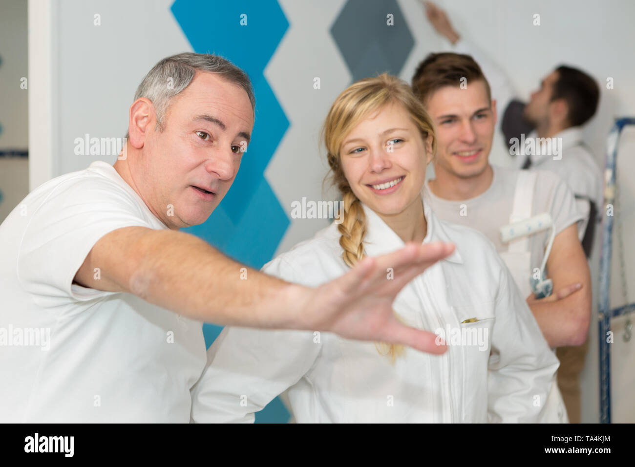 female apprentice talking to teacher Stock Photo - Alamy