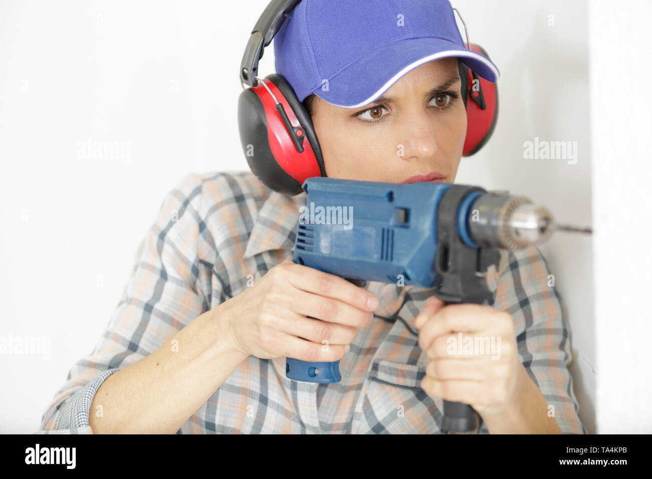 determinated woman using drill Stock Photo - Alamy