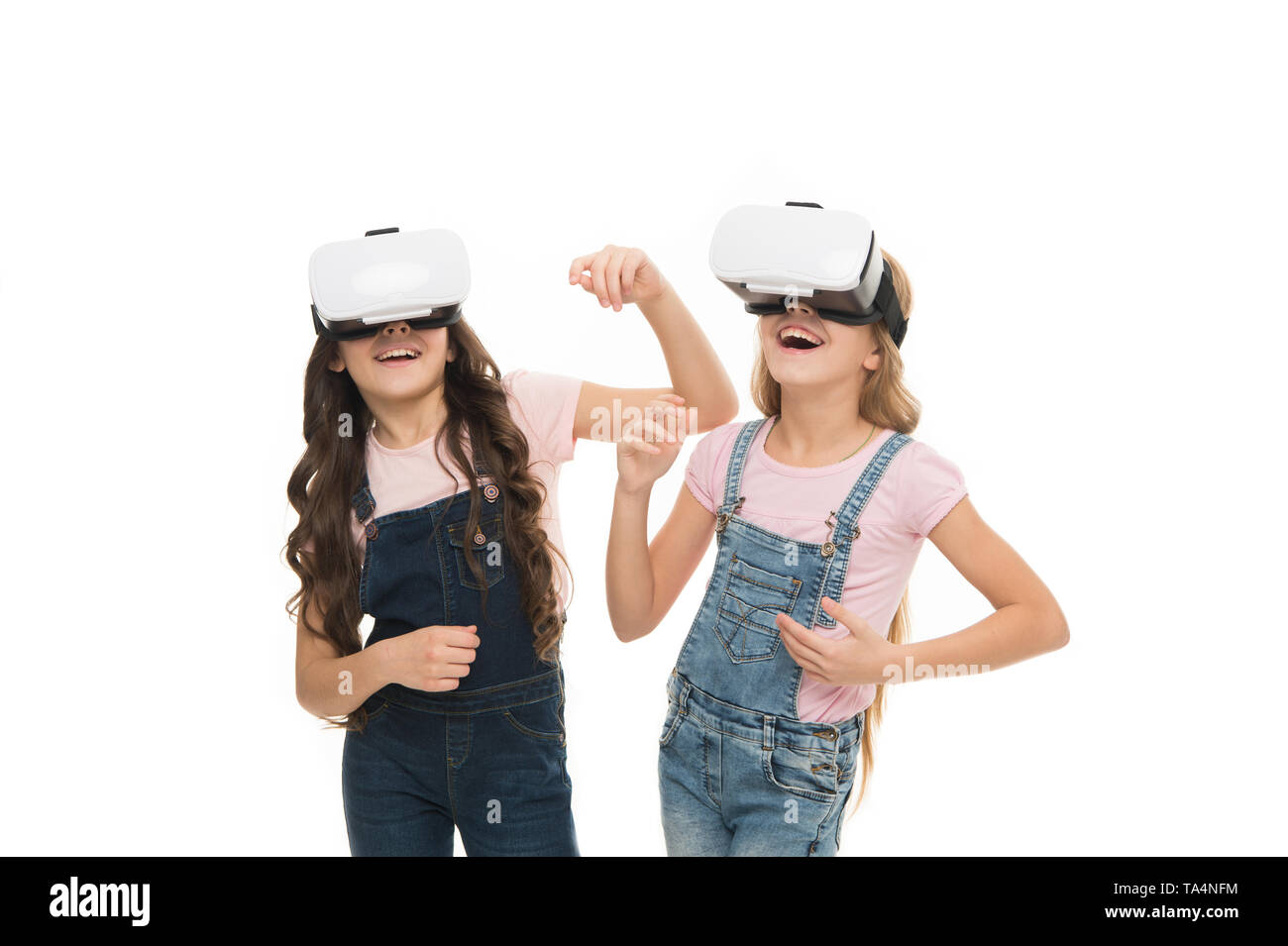VR tours for students. Little children wearing VR headsets. Small girls ...