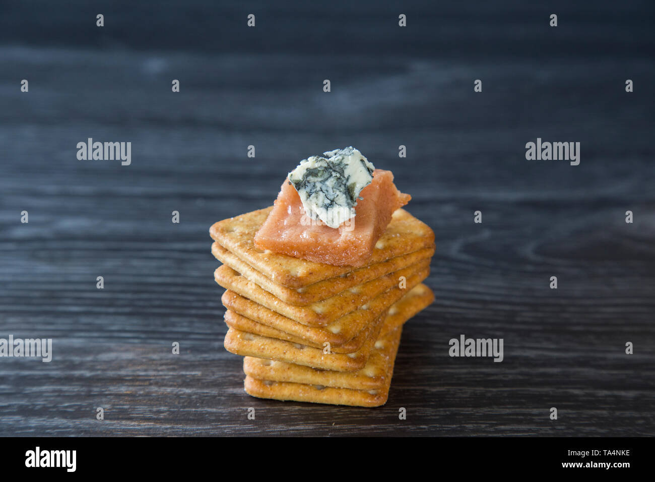 Delicious homemade quince paste served with creamy blue vein cheese and ...