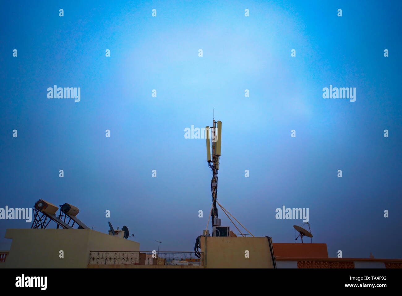 mobile telecommunications antenna on a roof Stock Photo - Alamy