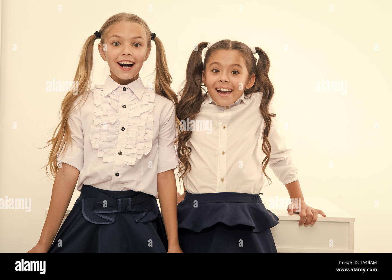Back to school is here. Little girls happy to be back to school. happy ...