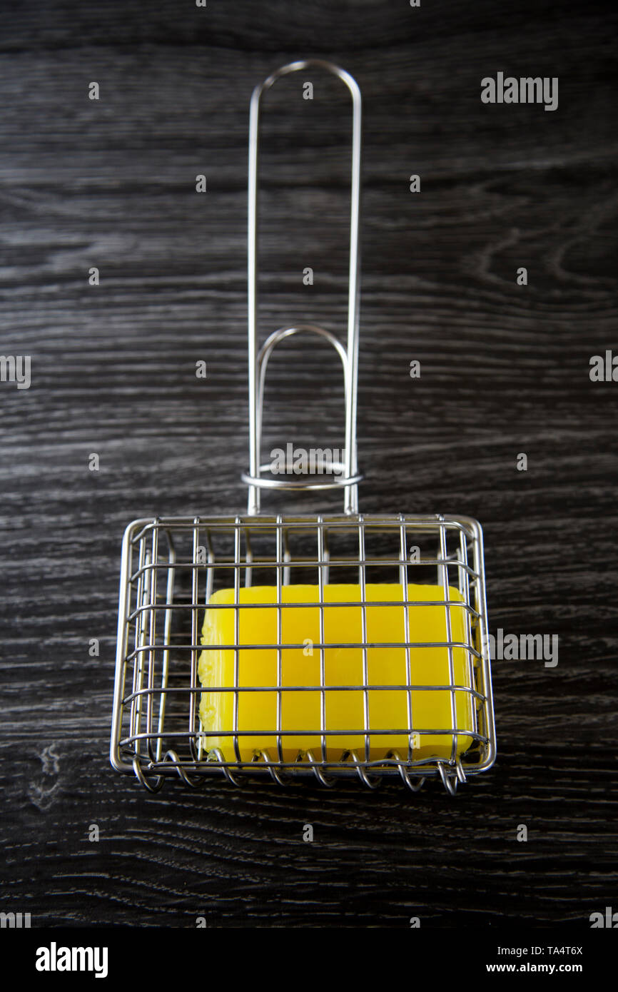 Stainless steel soap shaker with bar inside. Used to create soapy water ...