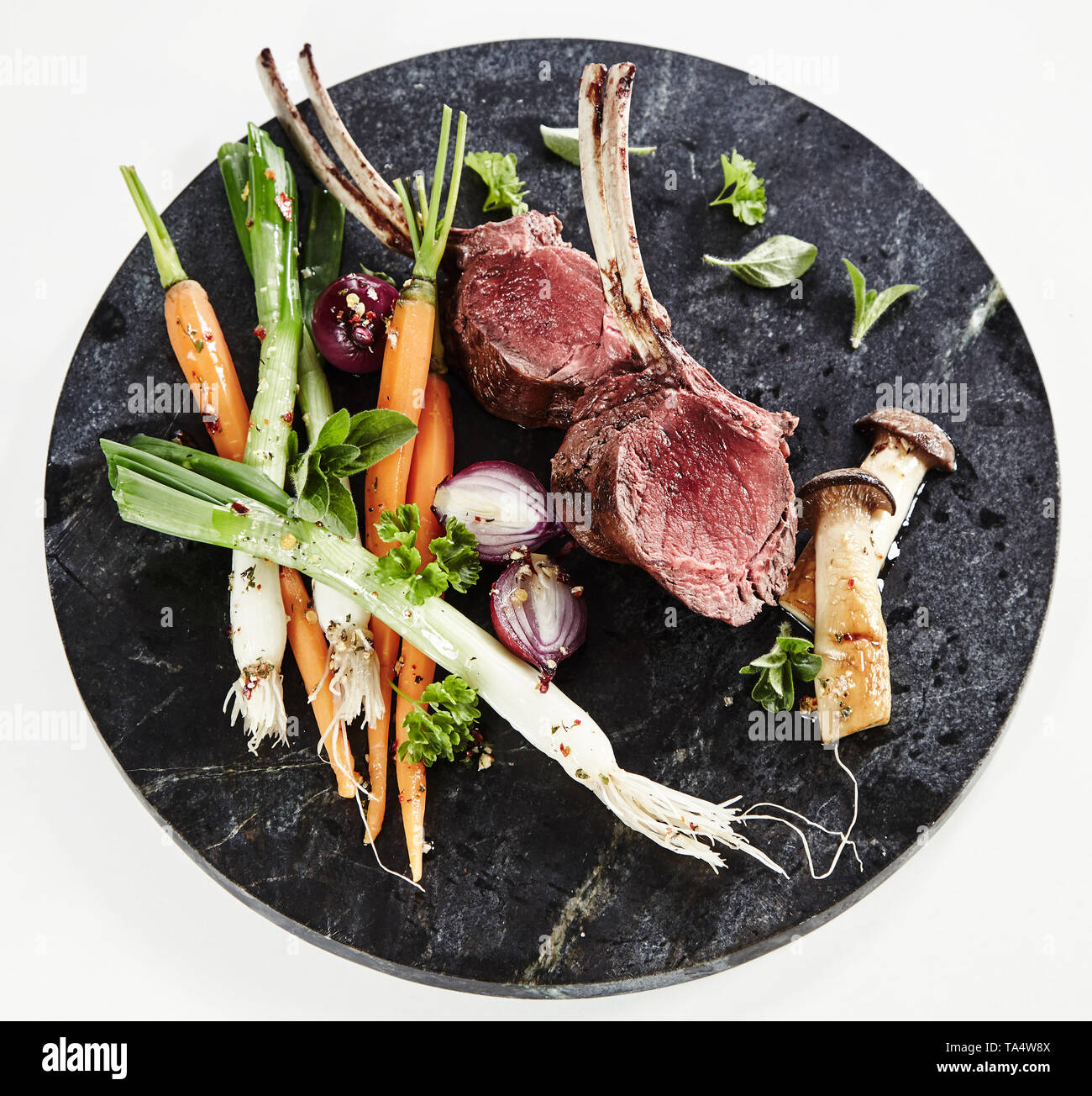 Lamb chops with baby carrots hi-res stock photography and images - Alamy