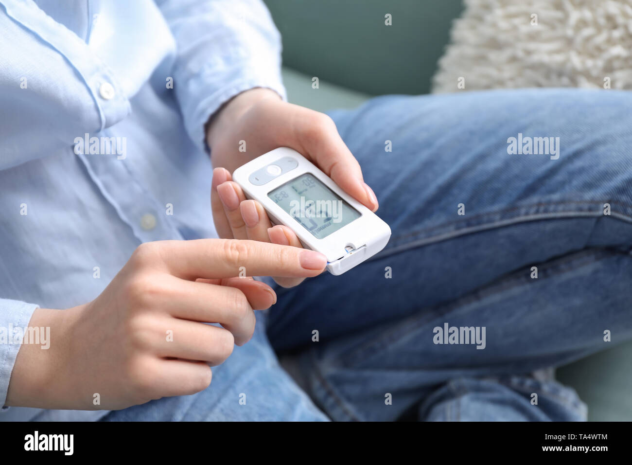 Woman taking diabetes test glucometer hi-res stock photography and ...