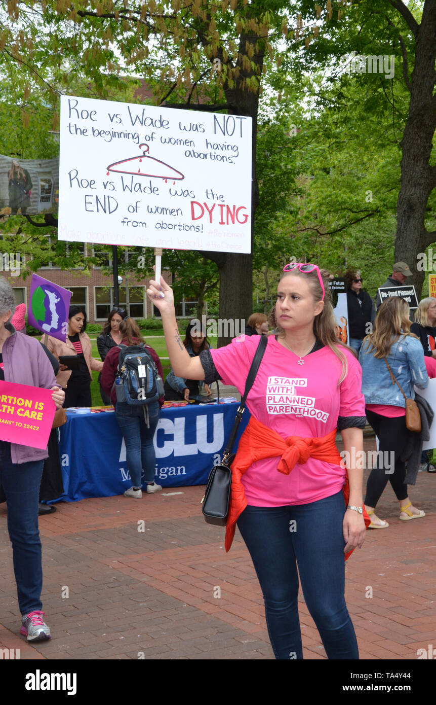 ANN ARBOR, MI/USA - MAY 21, 2019: Protester displays a sign before the ...