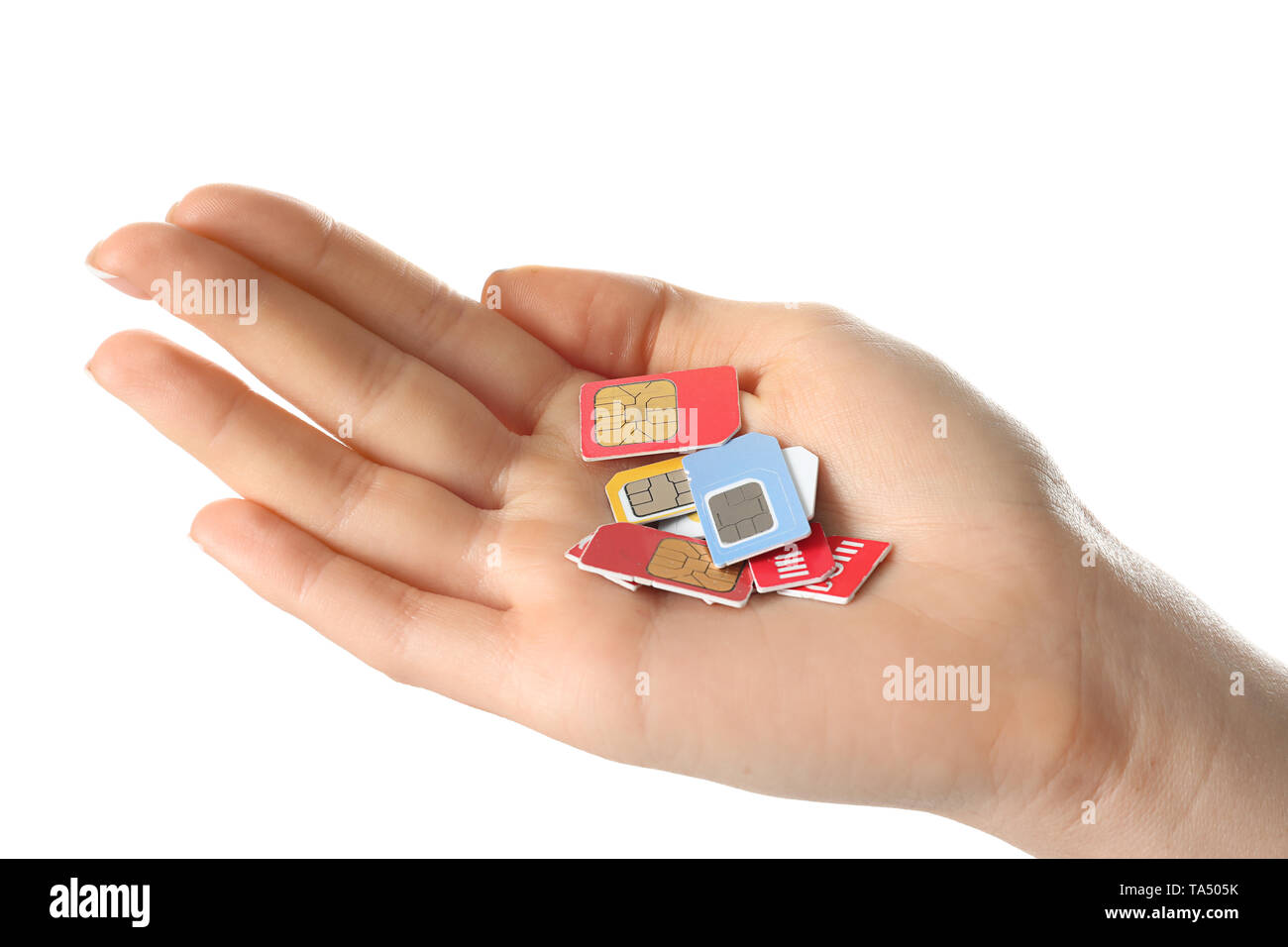 Female hand holding sim cards on white background Stock Photo - Alamy