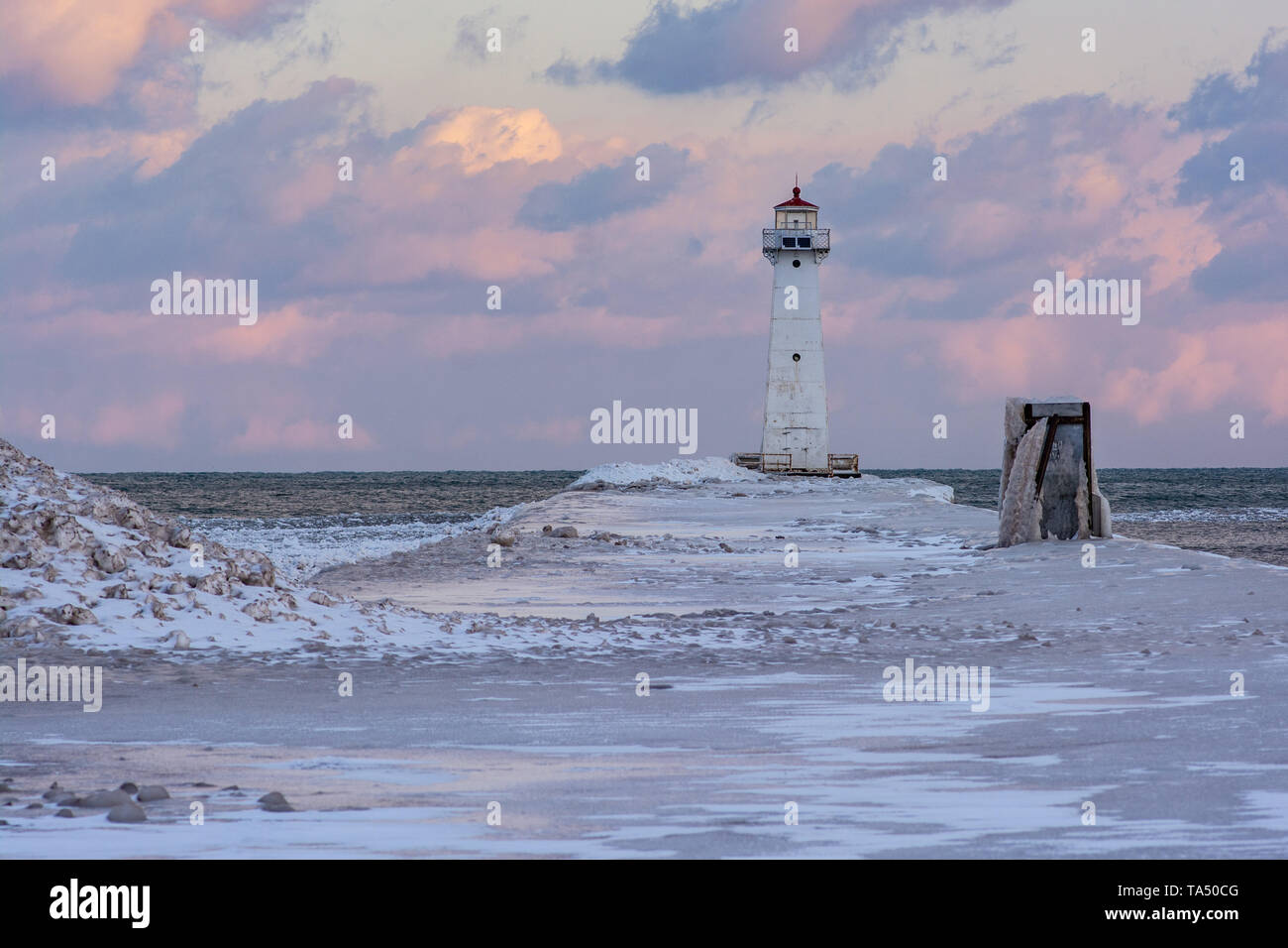 Winter scene of Sodus Bay lighthouse. This pier provides great ...