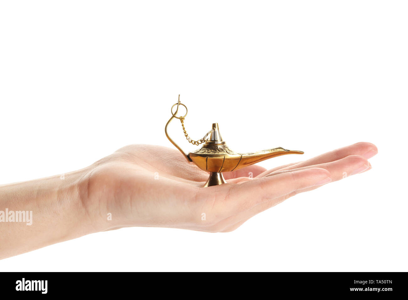 Female hand holding Aladdin lamp of wishes on white background Stock ...