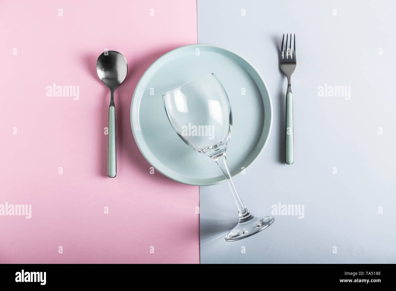 Simple table setting on color background Stock Photo - Alamy