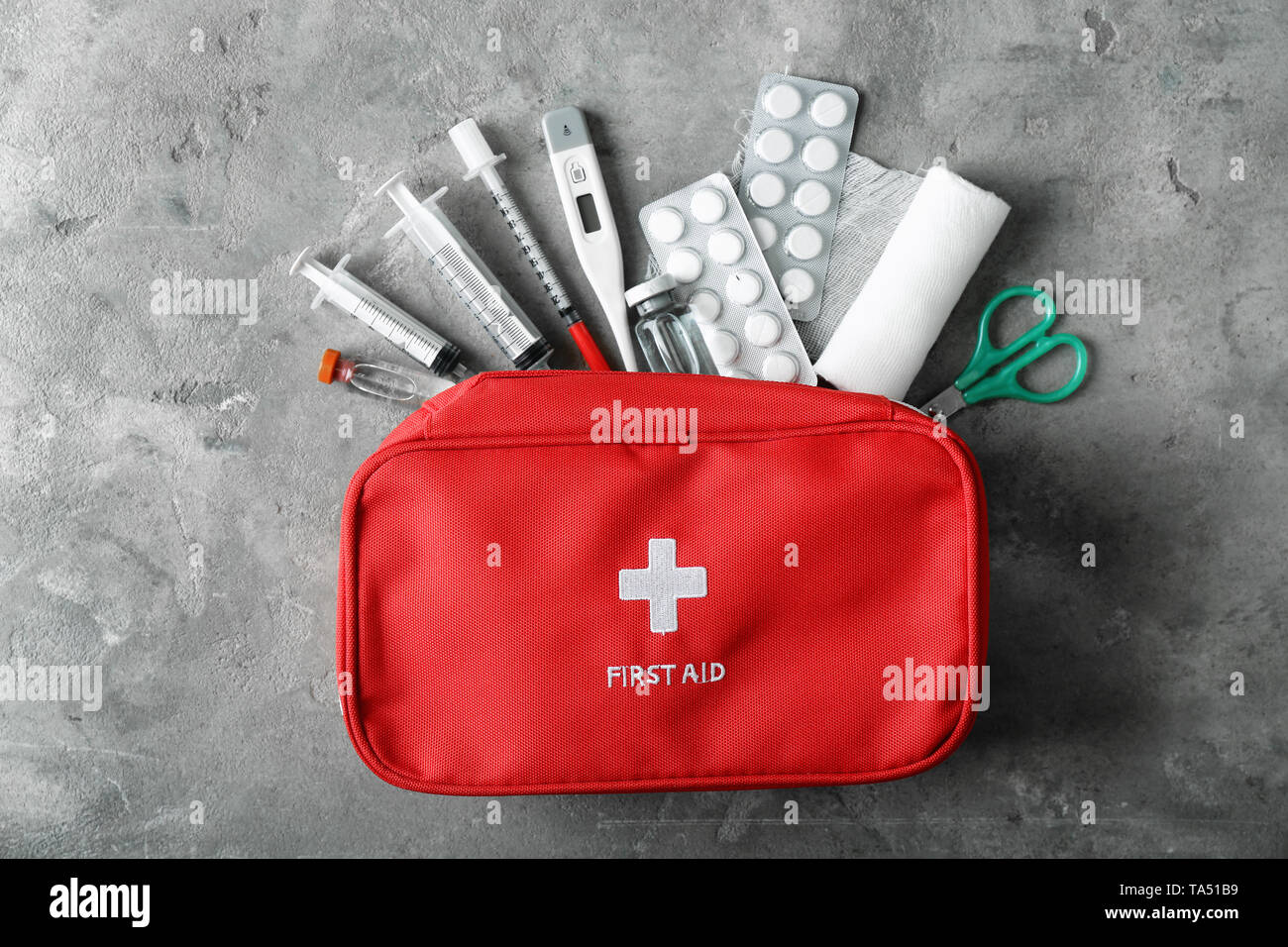 First aid kit on grunge background Stock Photo - Alamy