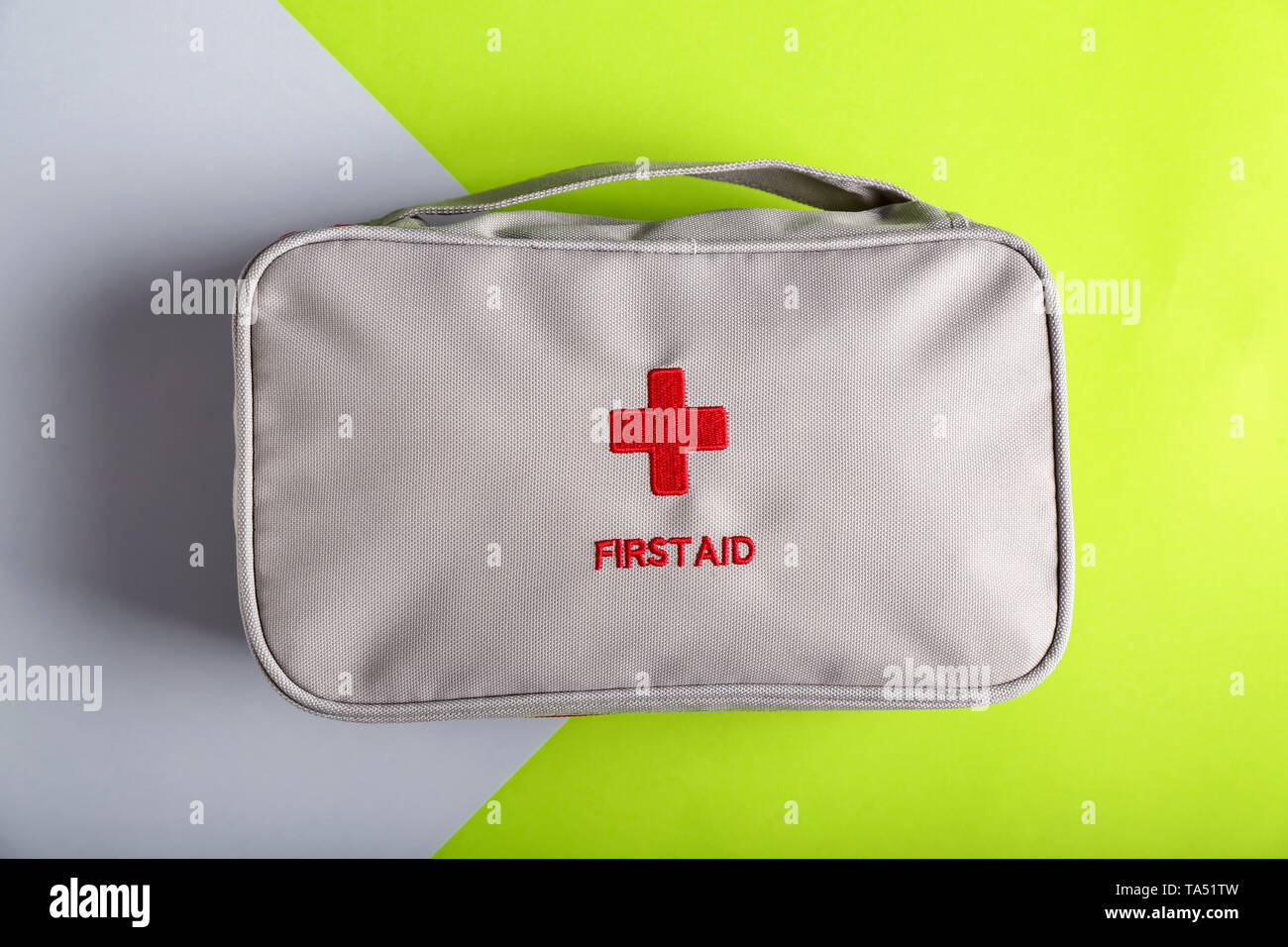 First aid kit on color background Stock Photo - Alamy