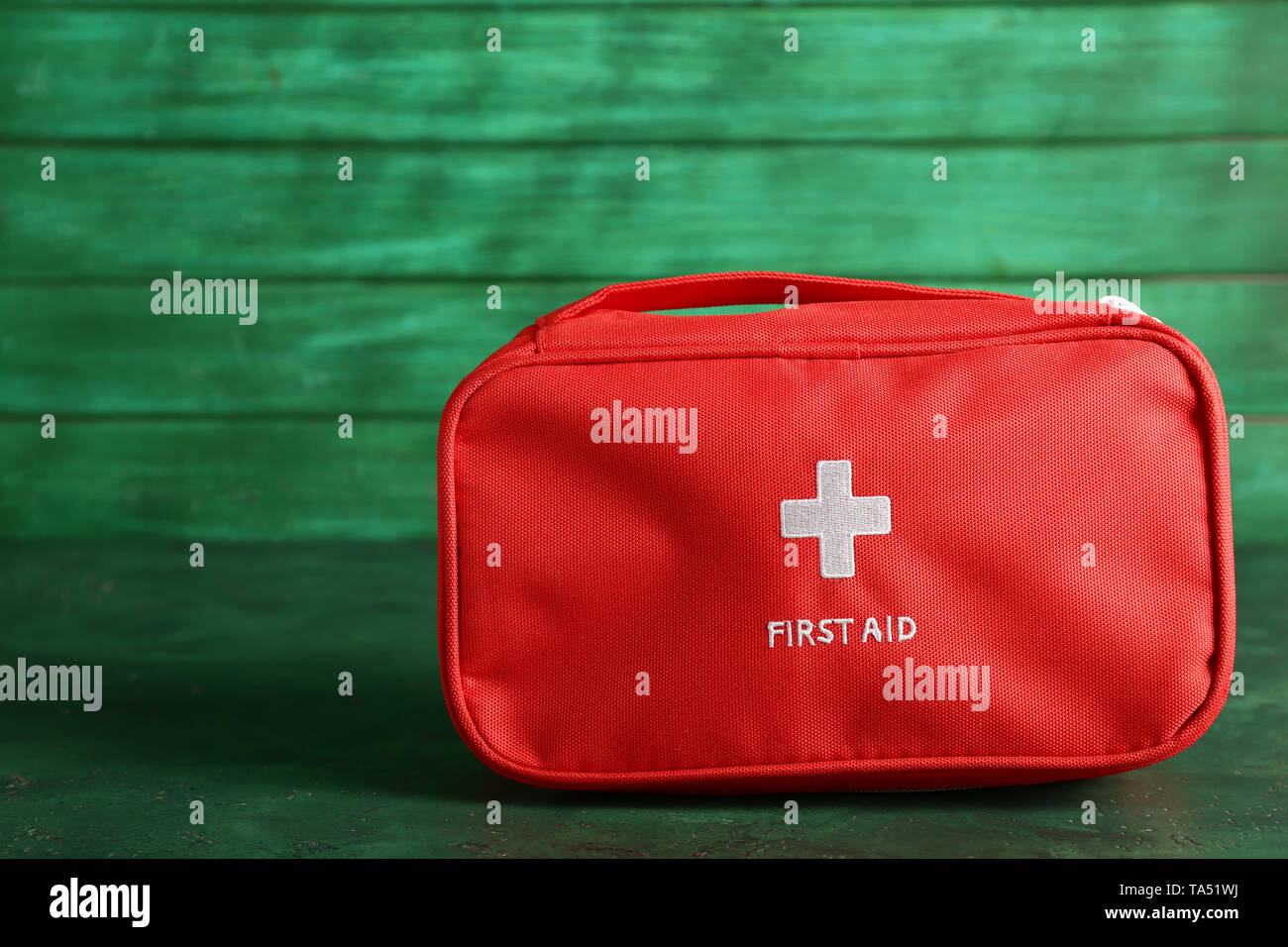 First aid kit on wooden background Stock Photo - Alamy