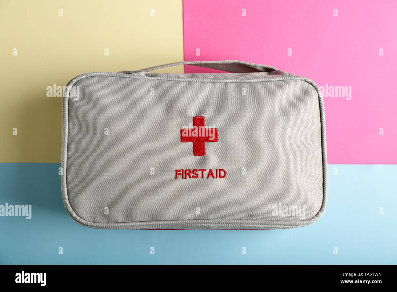 First aid kit on color background Stock Photo - Alamy