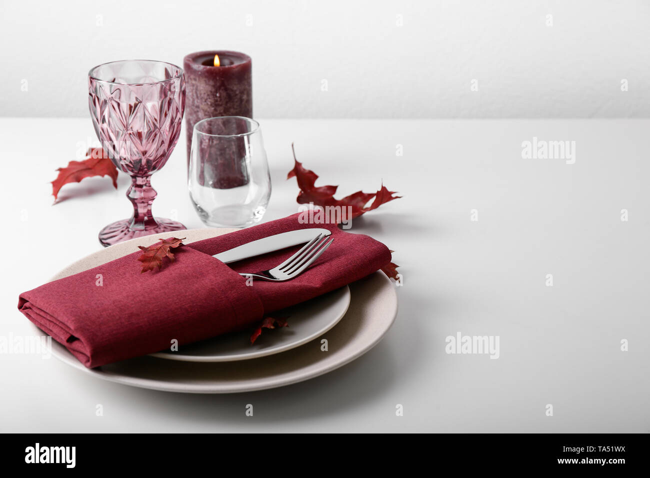Beautiful table setting on white background Stock Photo - Alamy