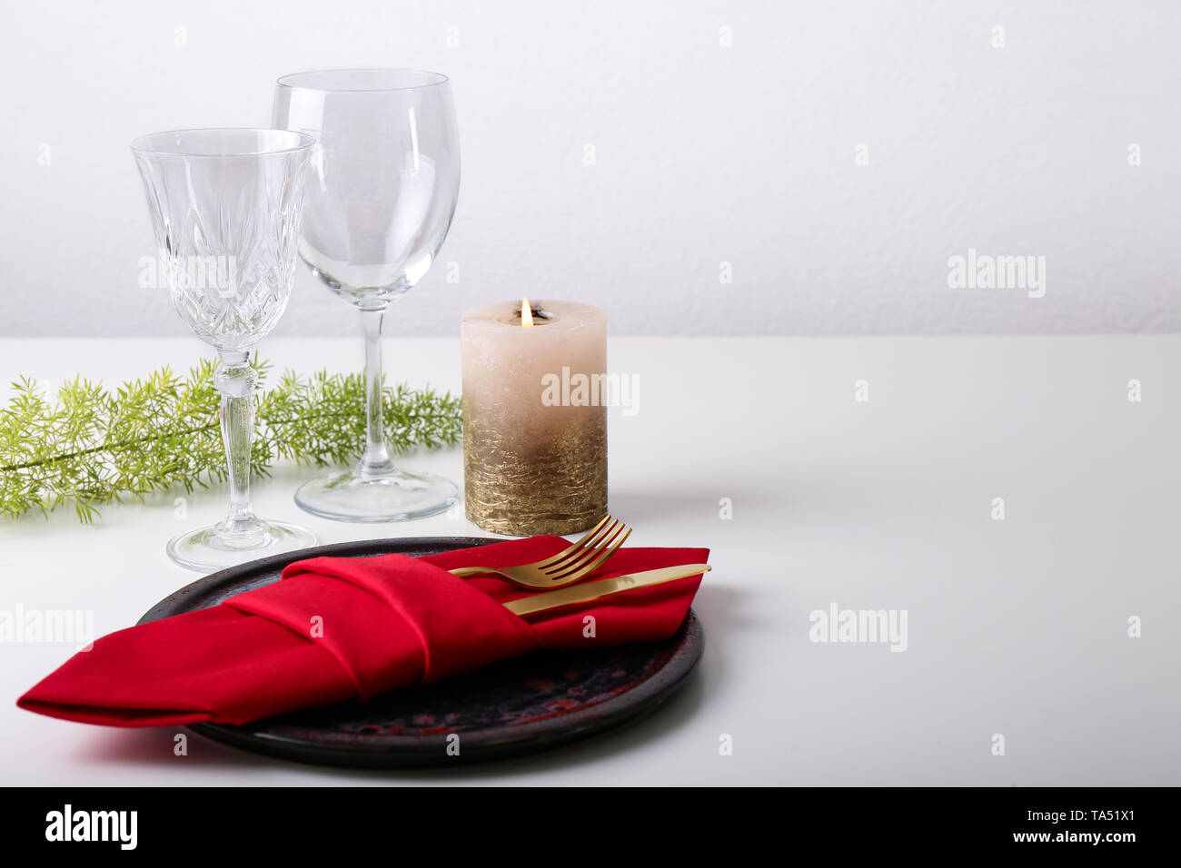 Beautiful table setting on white background Stock Photo - Alamy
