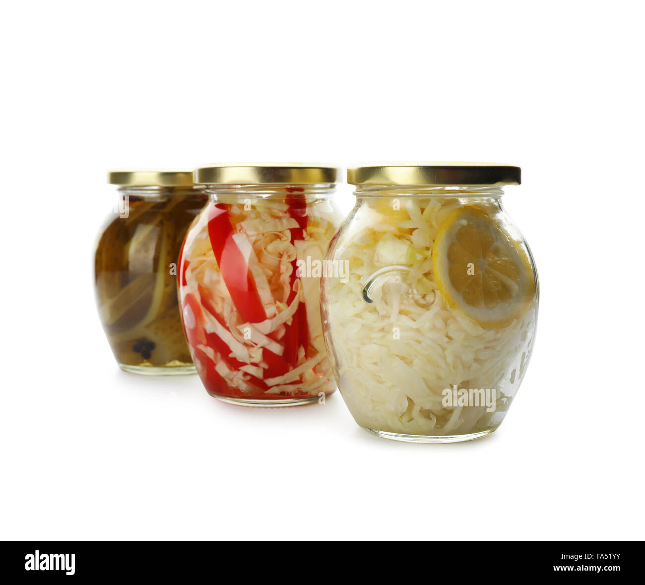 Glass jars with fermented vegetables on white background Stock Photo ...
