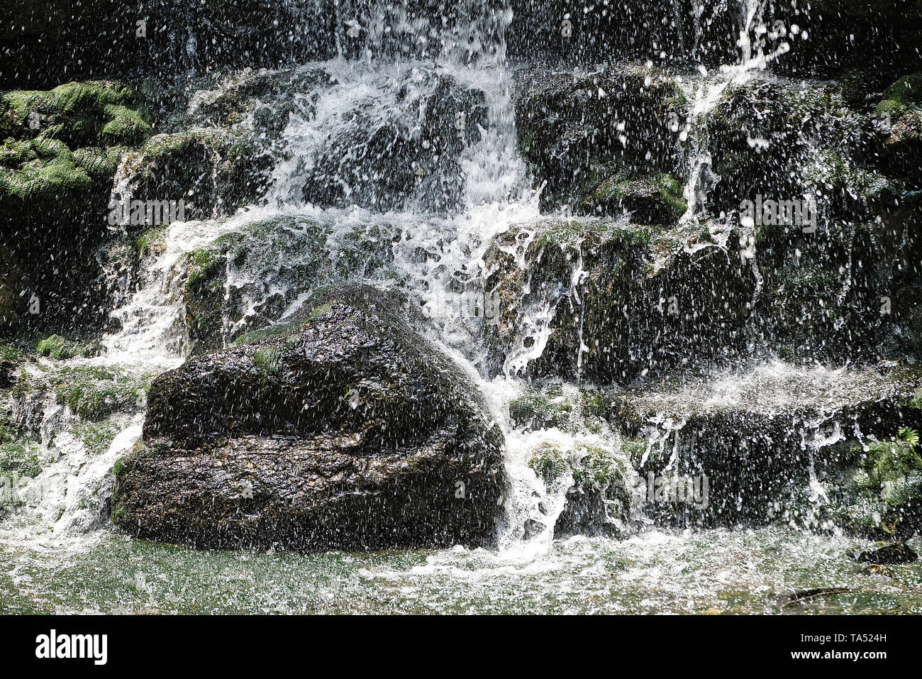 Water splashing on the rocks of a stair step terrace Stock Photo - Alamy