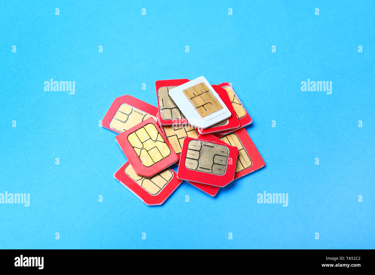 Many sim cards on color background Stock Photo - Alamy