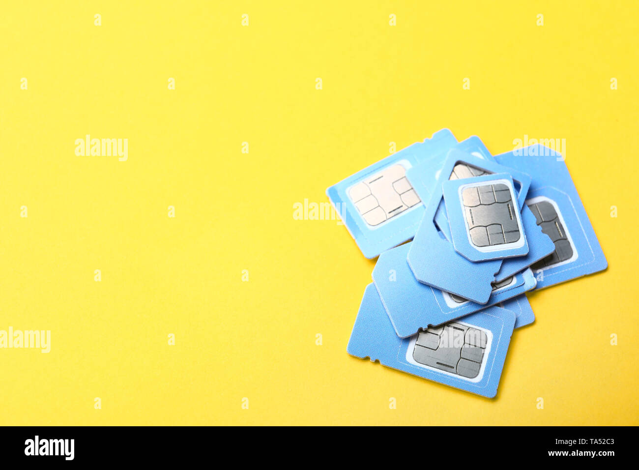 Many sim cards on color background Stock Photo - Alamy