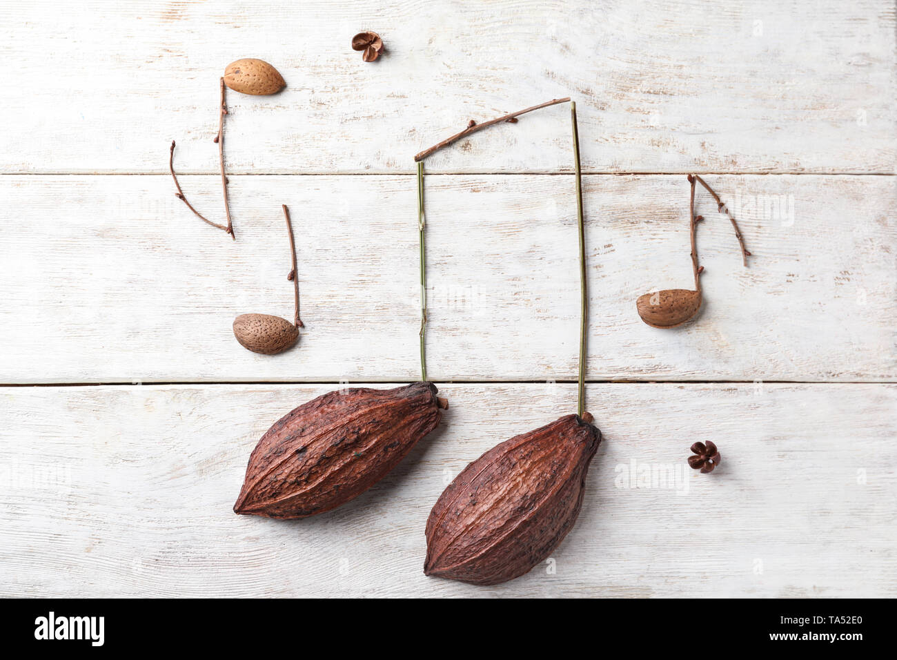 Music notes made of natural materials on wooden background Stock Photo ...