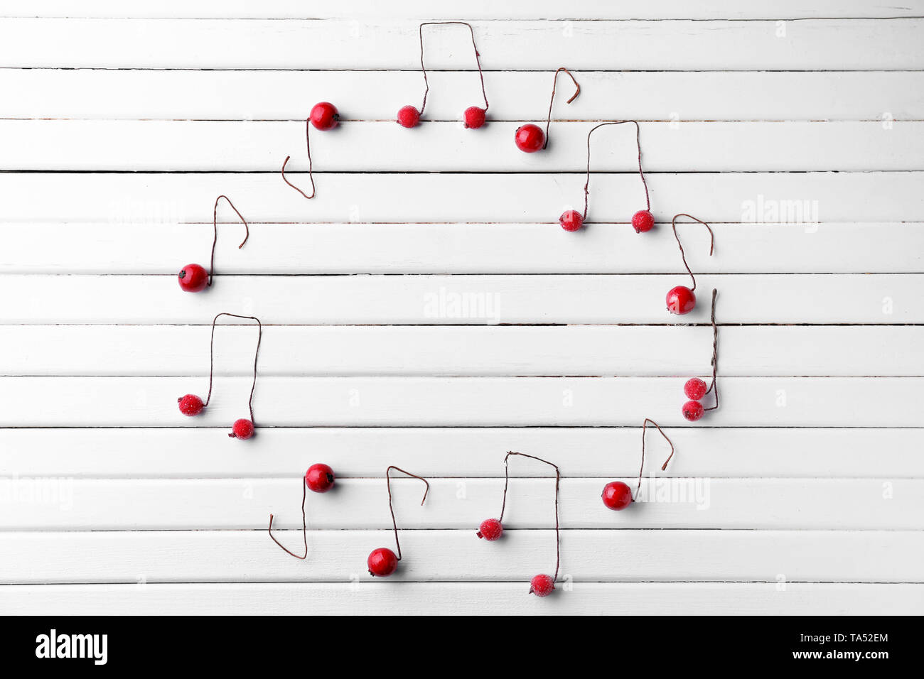 Frame made of music notes on white wooden background Stock Photo - Alamy