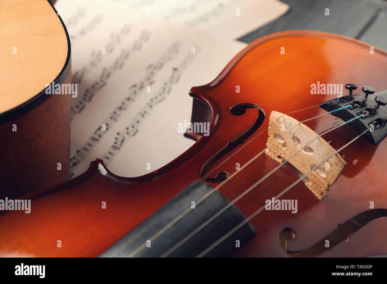 Violin and music sheets on table, closeup Stock Photo - Alamy