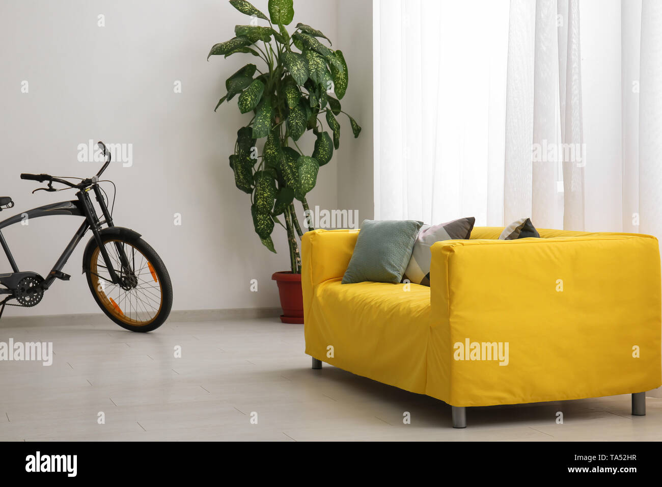 Interior of modern room with comfortable sofa Stock Photo - Alamy