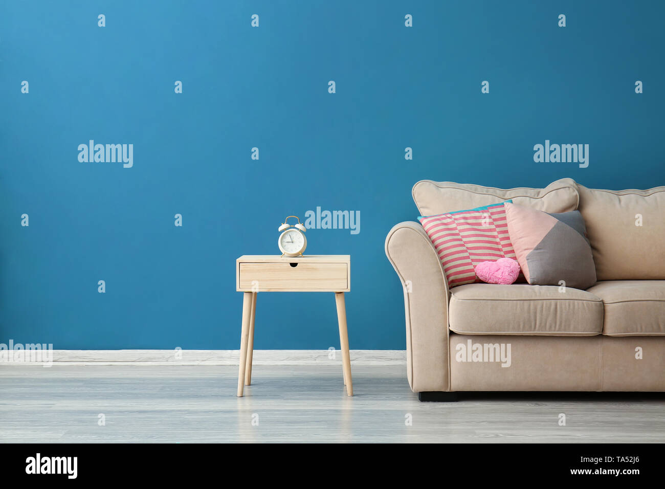 Interior of modern room with comfortable sofa Stock Photo - Alamy