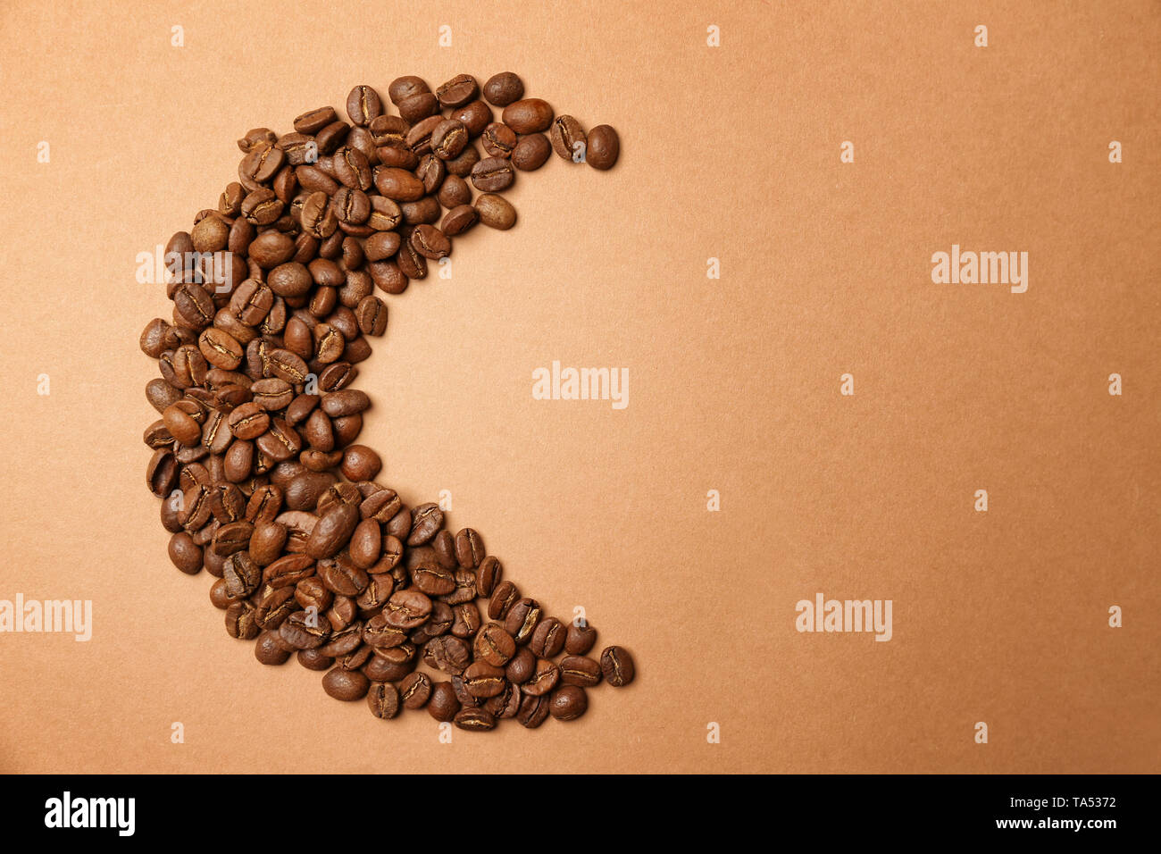 Half-moon made of coffee beans as symbol of Islam on color background ...