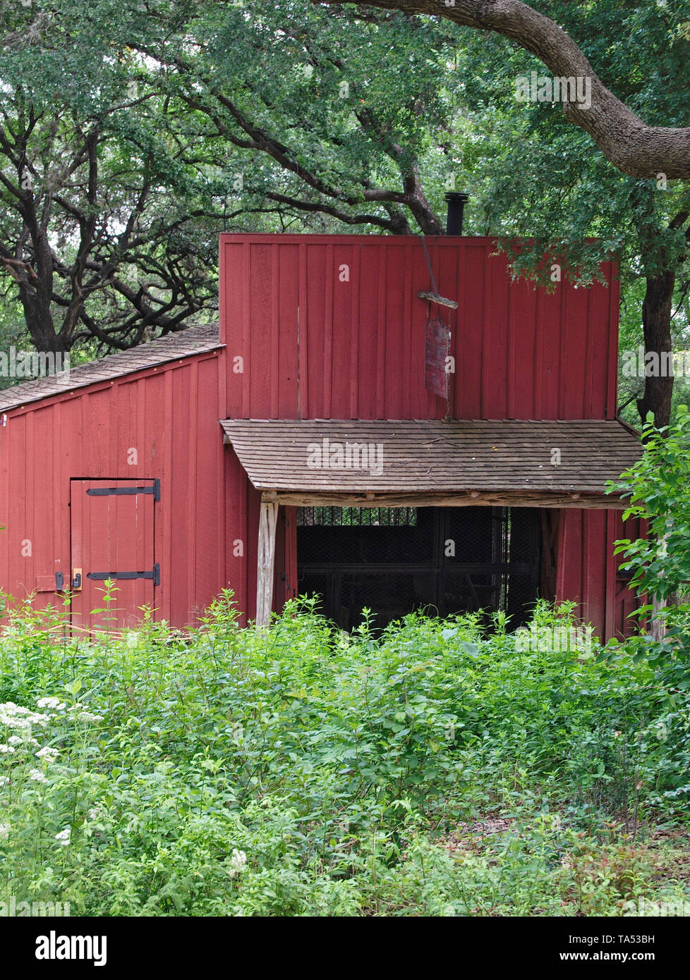 Old rustic red barn in the country with tall grass Stock Photo - Alamy