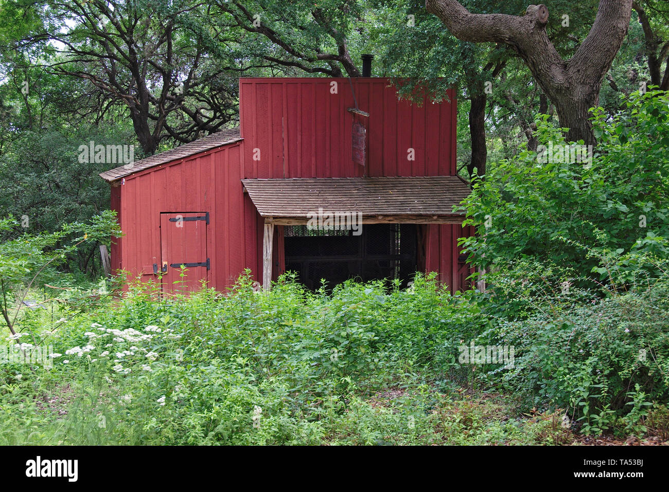 Old rustic red barn in the country with tall grass Stock Photo - Alamy