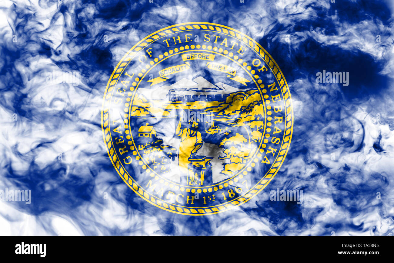 The national flag of the US state Nebraska in against a gray smoke on ...
