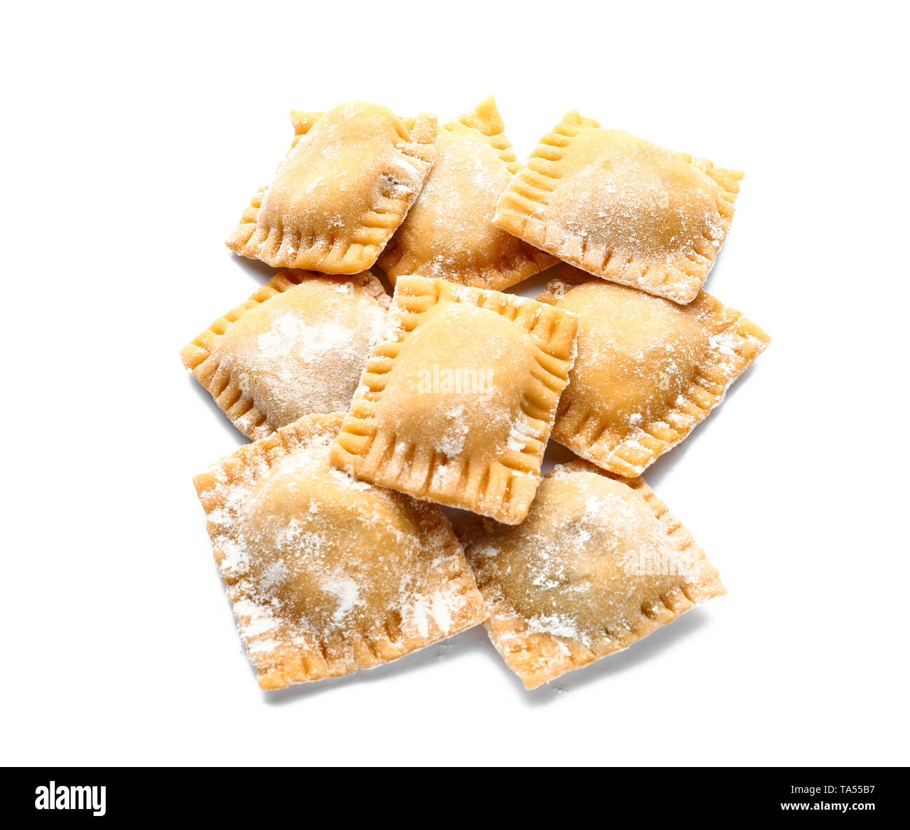 Uncooked ravioli on white background Stock Photo - Alamy