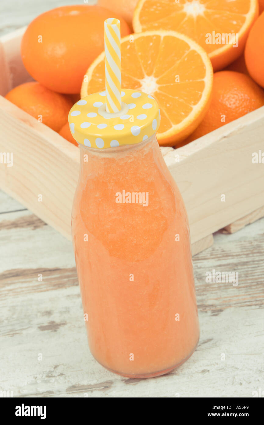 Fresh healthy smoothie from citrus fruits containing natural vitamins ...