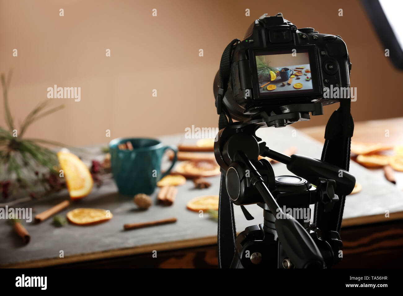 Photo of cup of tea on screen of professional camera in studio Stock ...