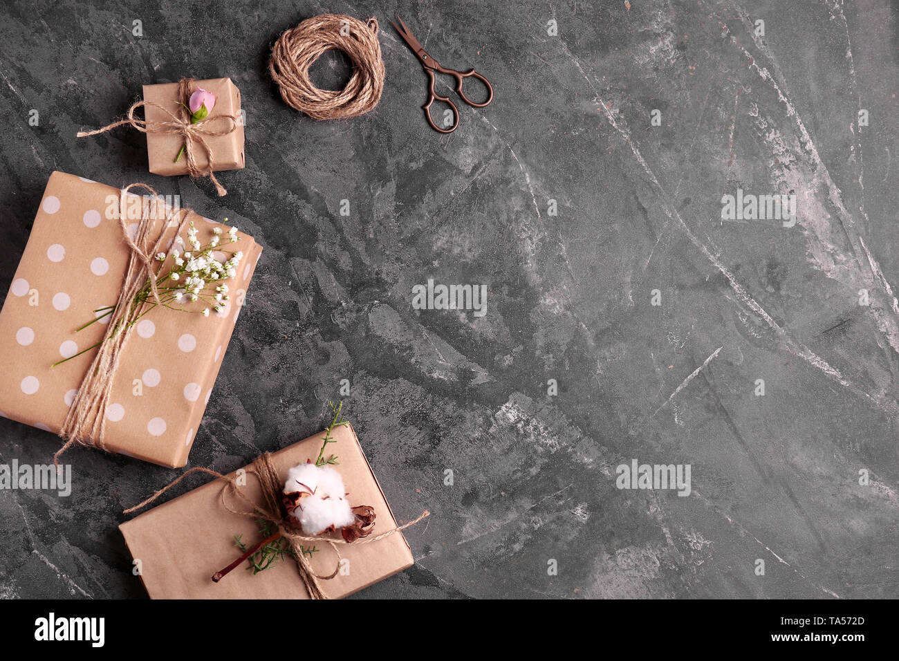 Handmade gift boxes on grunge background Stock Photo - Alamy